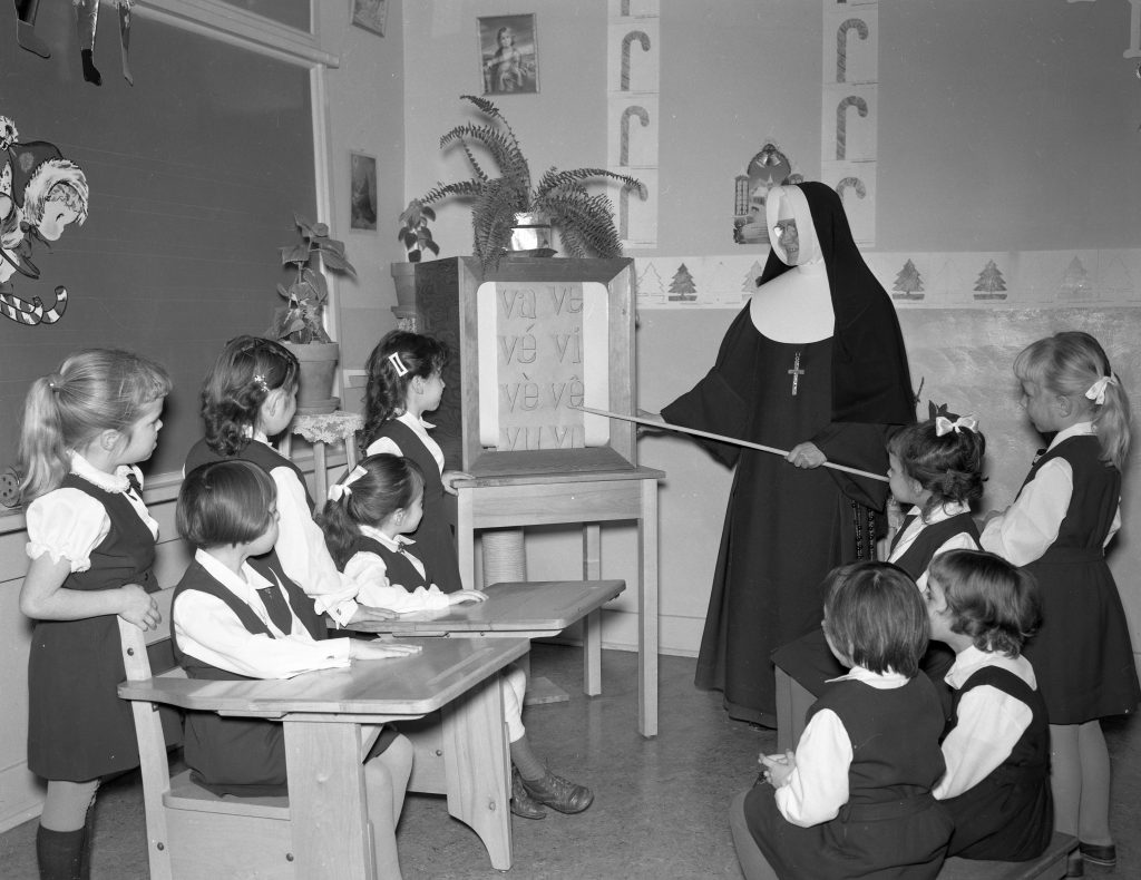 A Sister of the Little Franciscans of Mary and Her Students at the ...